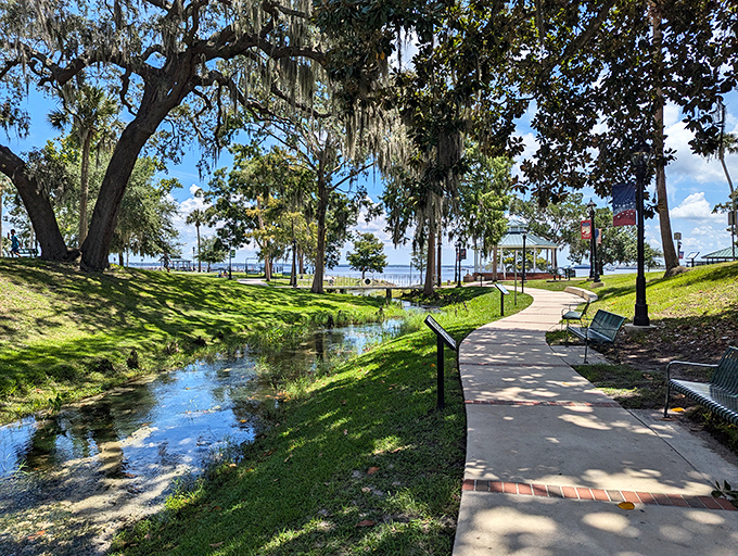 Springs Park: A serene pathway alongside crystal-clear spring waters – nature's air conditioning in the Florida heat.