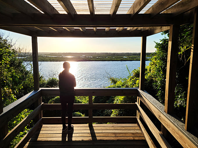 Watching the sunset from Turtle Mound turns visitors into silhouettes against nature's daily masterpiece, no filter needed for this Instagram moment.