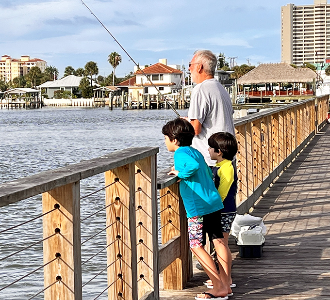 Three generations cast their lines and their cares into the Halifax River, participating in Florida's oldest family tradition – the shared story of "almost caught it!"