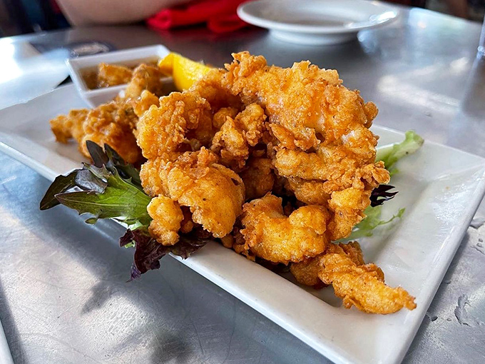 Golden-fried cracked conch that's worth every calorie. Crispy outside, tender inside &ndash; the way comfort food should be in paradise.
