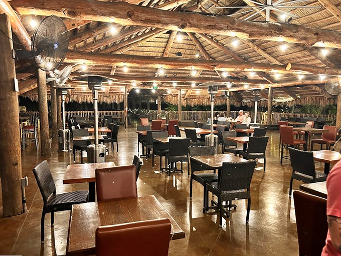 The open-air dining area combines rustic charm with tropical elegance, perfect for enjoying a meal paired with exotic fruit wines.