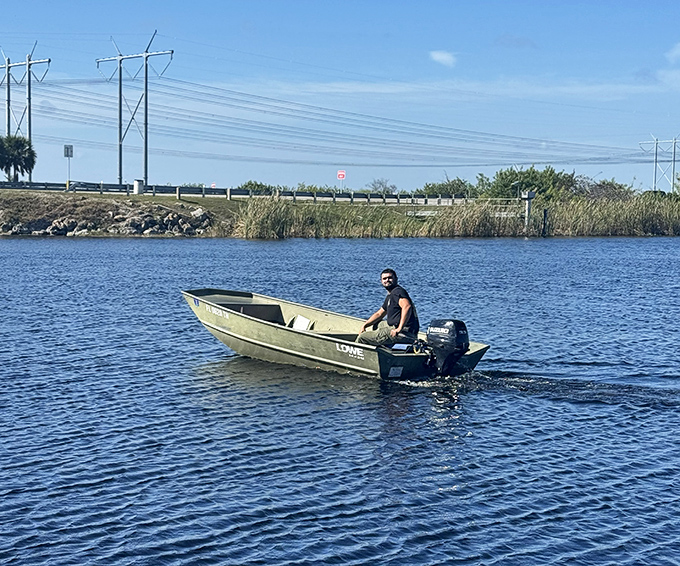 Sometimes the simplest vessels provide the most authentic experiences &ndash; this jon boat quietly navigates waters too shallow for conventional craft.