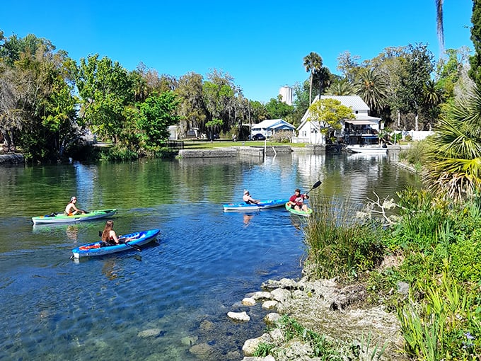Gliding across the glassy surface in colorful kayaks, adventurers get a different perspective on this aquatic wonderland.
