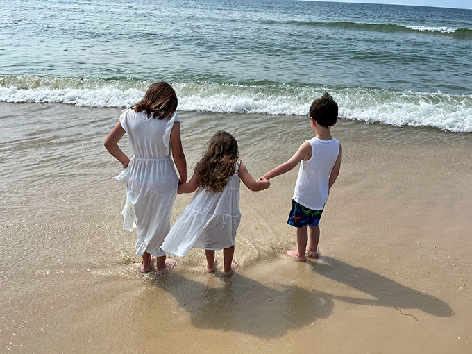 The simple joy of tiny toes meeting the Gulf &ndash; childhood memories in the making on St. George Island's family-friendly shores.