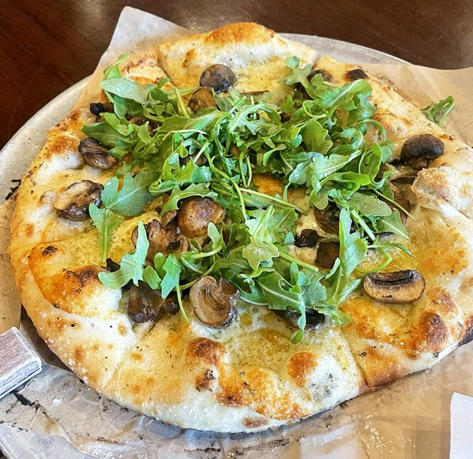 A forest floor of flavors topped with peppery arugula &ndash; it's like nature and nurture had a delicious pizza baby.