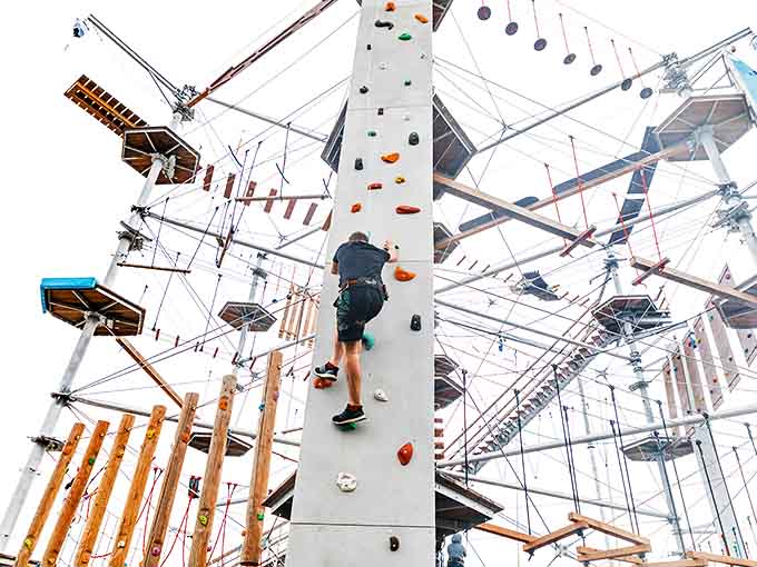 Scaling the climbing wall requires equal parts determination, upper body strength, and a willingness to look slightly ridiculous for a great story.