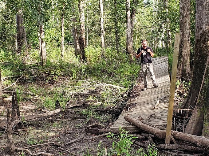 A solitary explorer captures the bridge's eerie beauty, where history and legend intertwine in the Florida wilderness.