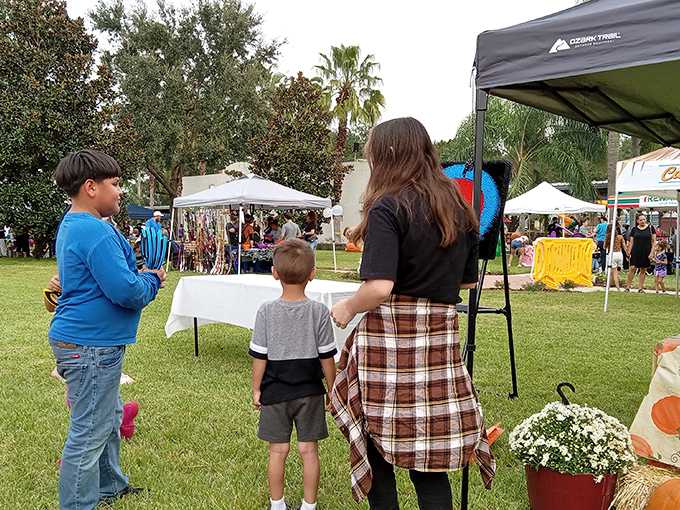 Local markets bring the community together, where families browse handcrafted goods and farm-fresh produce under the park's protective canopy.