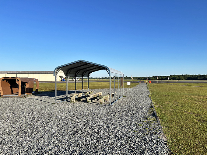 The covered waiting area where nervous energy meets excited anticipation, and everyone pretends they're totally calm about the whole jumping thing.