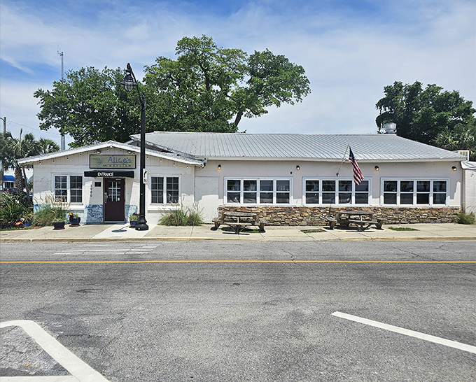 Rainbow-colored chairs create a cheerful setting for serious oyster enjoyment. Alice's waterfront deck offers the perfect perch for watching boats drift by.