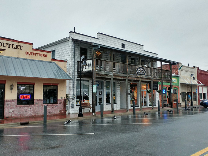 Rain-soaked storefronts in downtown Crystal River showcase the town&rsquo;s small-town charm, with local shops and rustic architecture lining the quiet main street.