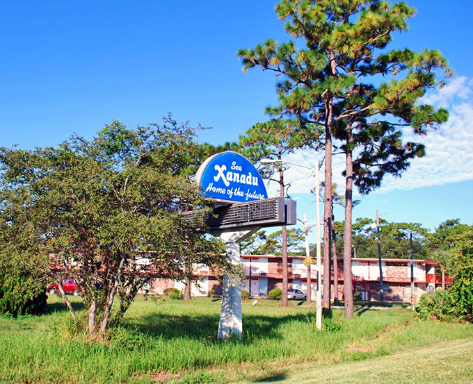 Time capsule on a pole: this vintage sign for the "Home of the Future" now serves as a monument to retro optimism and architectural dreams that never quite materialized.