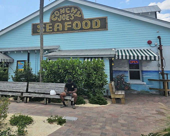 The classic sign promises seafood delights inside this Old Florida institution where conch fritters and key lime pie reign supreme.