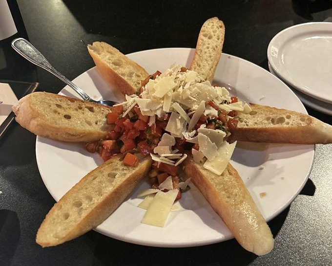 Bruschetta arranged like edible art, proving that appetizers can be both Instagram-worthy and actually worth eating.