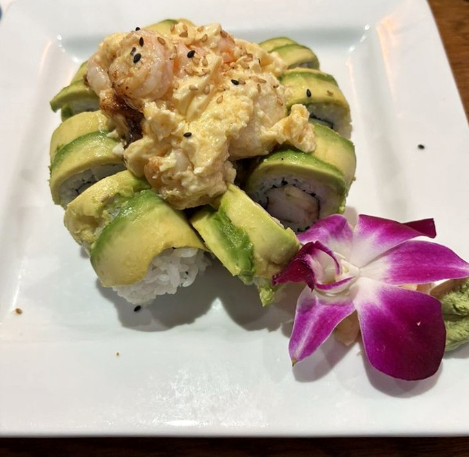 This architectural wonder doesn't just sit on the plate &ndash; it poses, complete with a purple orchid garnish that's almost too pretty to eat. Almost.