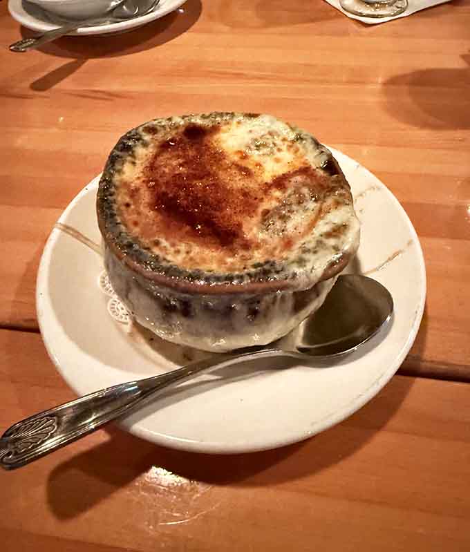 French onion soup done right, with bubbling cheese and rich broth that'll warm you from the inside out on any evening.