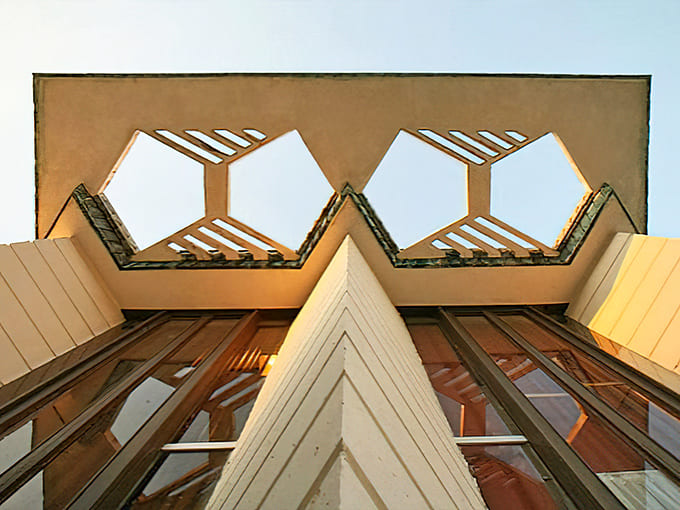 Wright's geometric genius on full display, where every angle and shadow was calculated to create visual poetry in concrete.