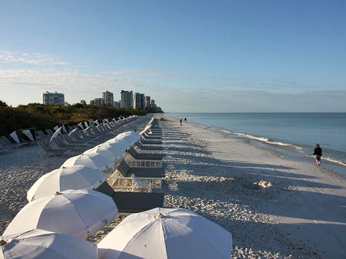 These pristine beach loungers await your arrival like reserved seats at nature's most spectacular daily performance of relaxation.