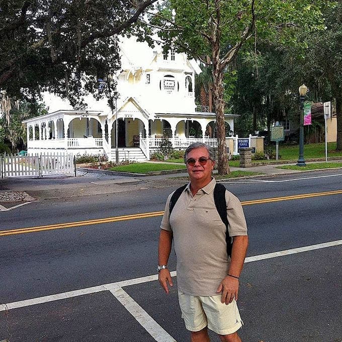Nothing says "I survived the ghost tour" quite like posing in front of the house afterward, preferably before the adrenaline wears off completely.