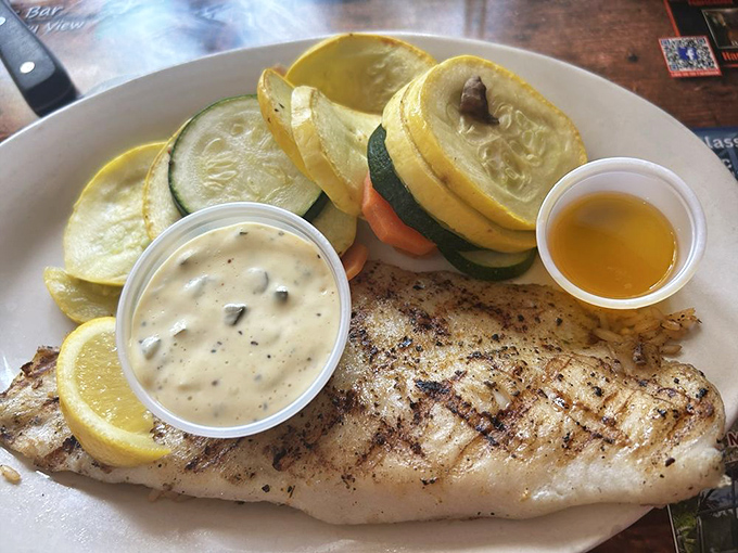 Perfectly flaky fish meets lemon-butter simplicity&mdash;proof that sometimes the simplest preparations yield the most spectacular results.