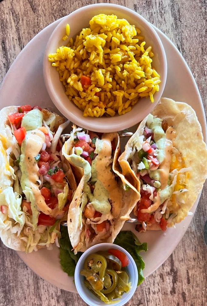 Crisp fish tacos paired with sunny yellow rice create a plate as colorful as a Florida sunset.