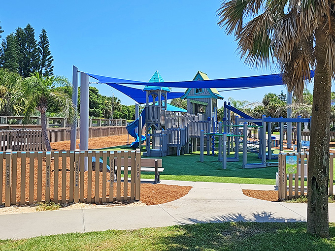 The colorful playground at James H. Nance Park offers little adventurers a break from sand castles under the watchful shade of palm trees.