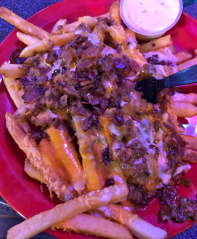 A mountain of crispy fries buried under an avalanche of cheese, bacon, and ranch. Archaeologists of the future will study how we created such delicious excess.