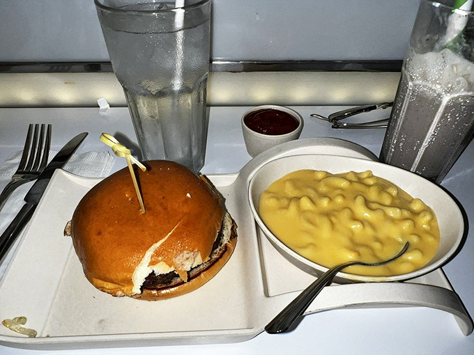 Mac and cheese cozies up to a burger like they're old friends at a drive-in double feature &ndash; comfort food that's ready for its close-up.