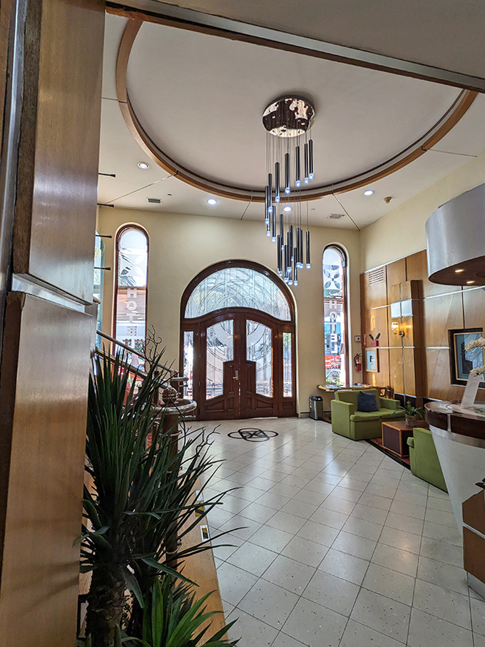 The lobby doesn't whisper elegance&mdash;it announces it with a chandelier that's seen more interesting conversations than most therapists. Light dances across the polished floor like it's auditioning.