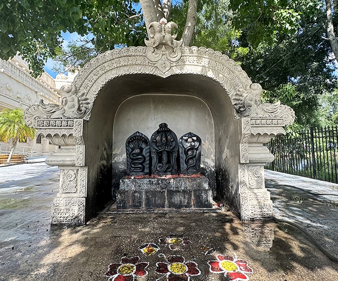 These Naga Devatas (serpent deities) stand guard in their shrine, looking both regal and slightly judgmental of your life choices.