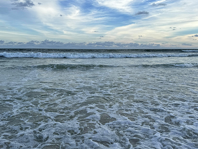 The Gulf of Mexico shows off its crystal-clear credentials, where each wave arrives like nature's own cleaning service, refreshing the shoreline throughout the day.