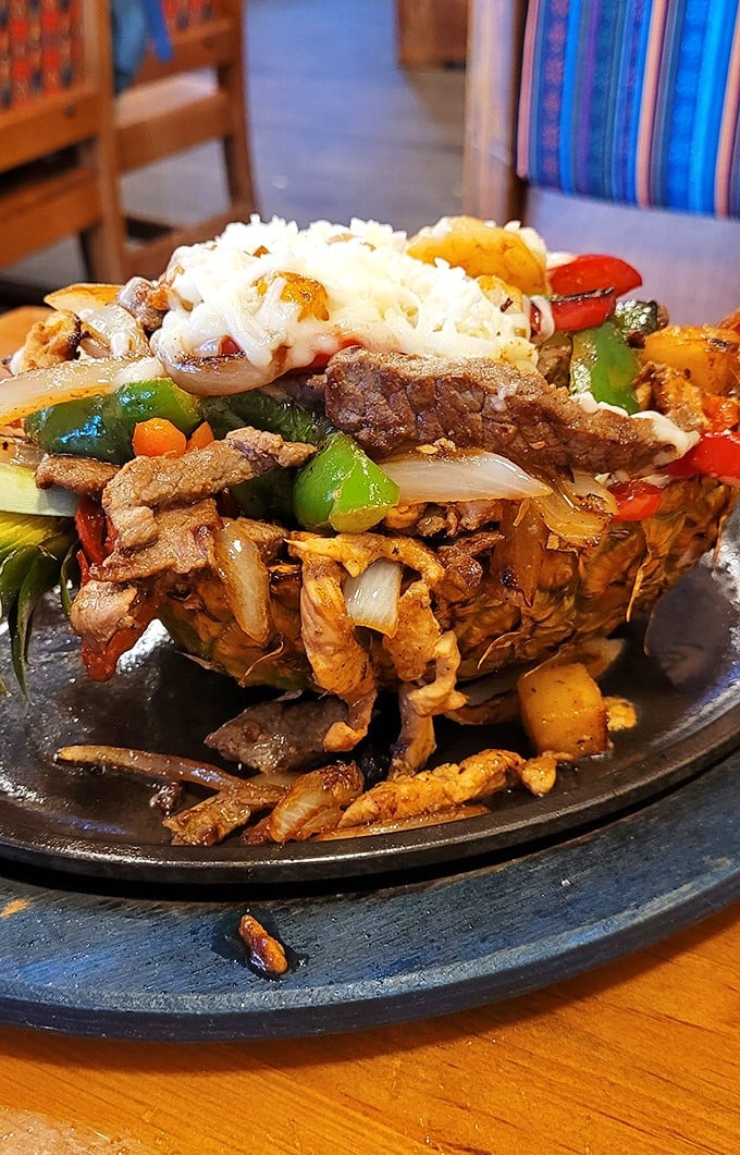 The Pineapple Fajitas aren't just a meal, they're edible architecture &ndash; a tropical vessel filled with savory treasures.
