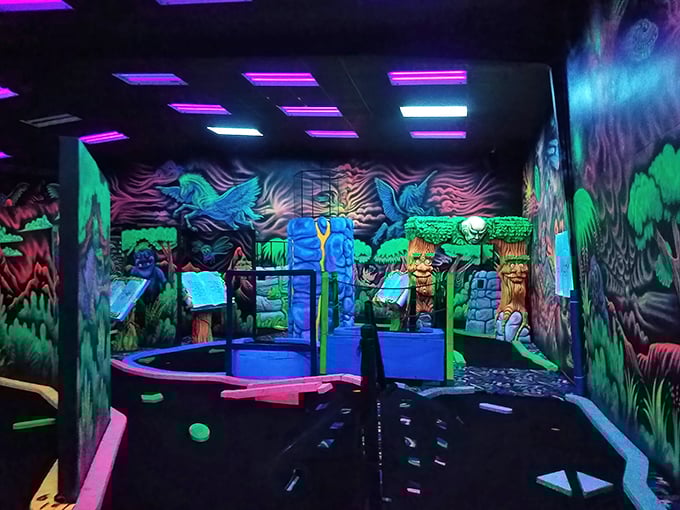 Blacklight colors turn this trampoline area into a vibrant, glowing playground where every jump feels like pure magic.