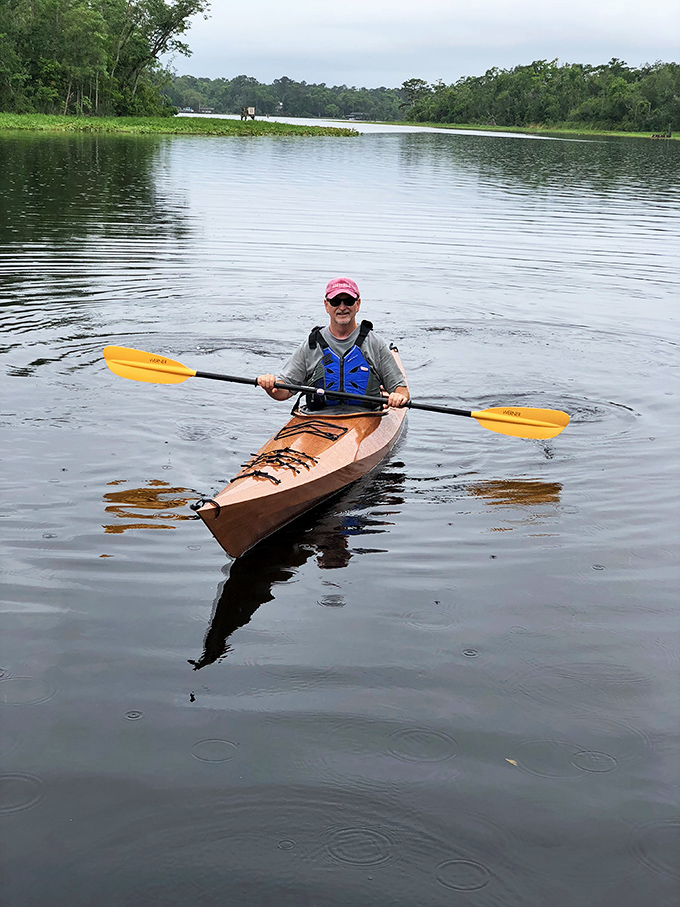 Nothing beats hands-on learning! A kayaker explores the tranquil waters surrounding Apalachicola, creating memories more lasting than any souvenir t-shirt.