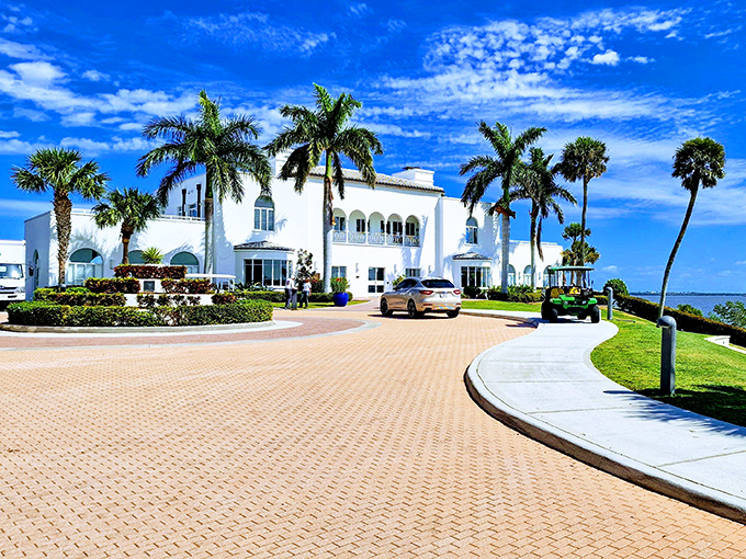 The mansion's pristine white fa&ccedil;ade gleams against azure skies, showcasing the Mediterranean Revival architecture that transports visitors to another era.