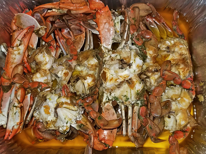 These magnificent crustaceans have sacrificed themselves for your pleasure, their shells glistening with garlicky goodness in a buttery sea.