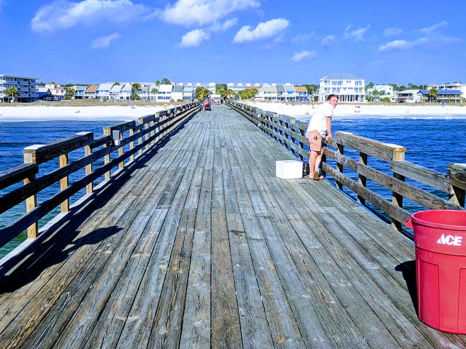 The Mexico Beach pier stretches toward the horizon like a wooden runway, inviting fishermen to strut their angling stuff.