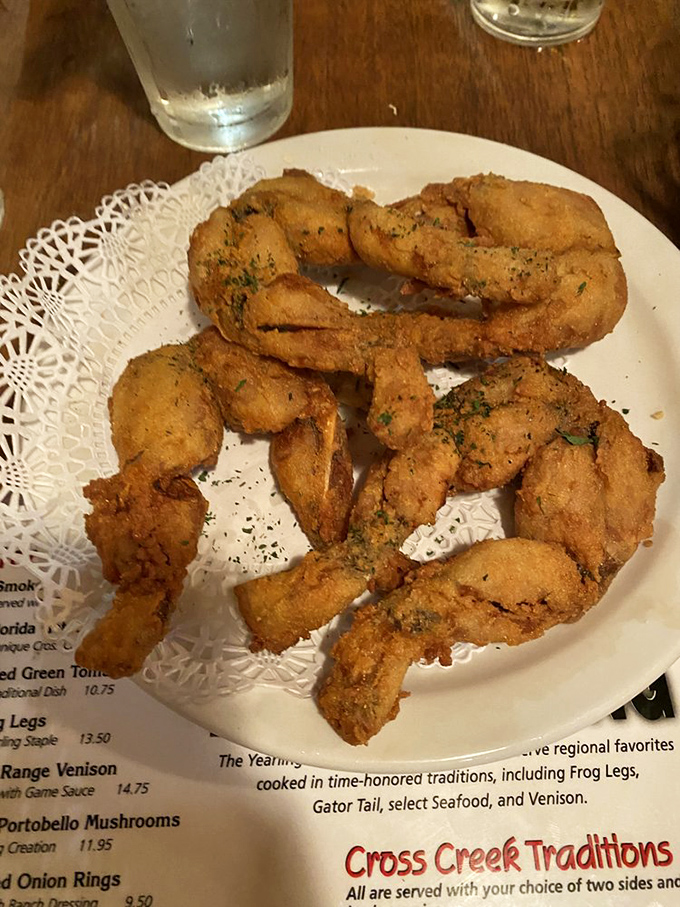 Golden-fried frog legs arrive sprinkled with fresh herbs on delicate paper doilies &ndash; perhaps the most elegant presentation of amphibian limbs you'll ever encounter.
