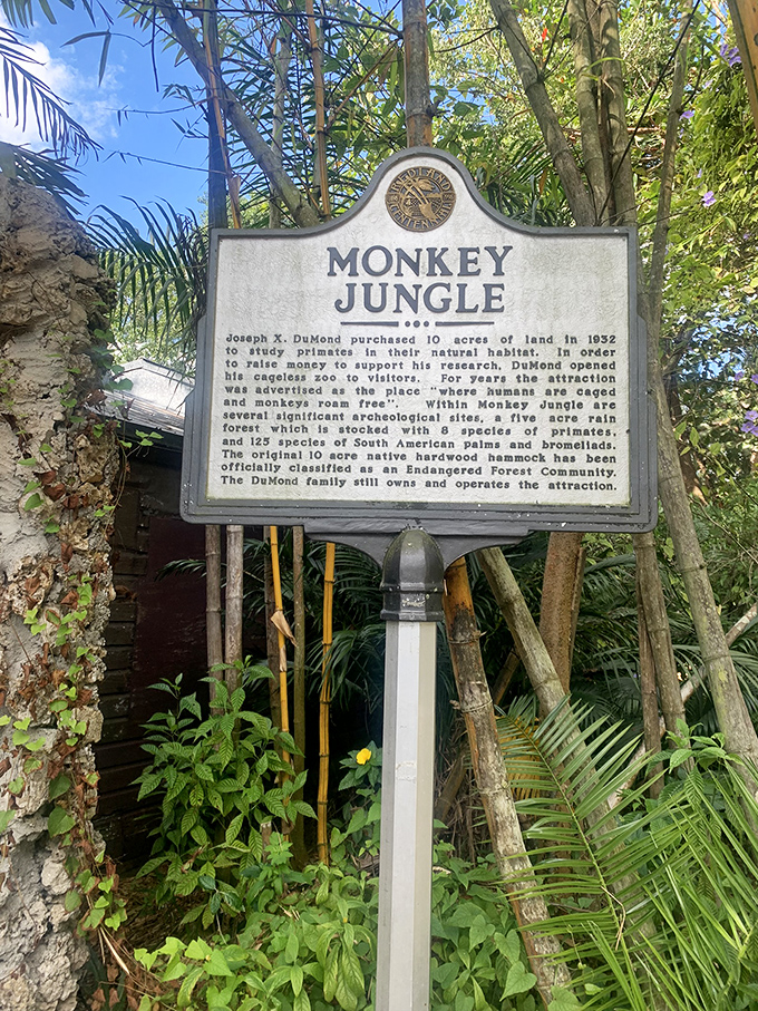 The historical marker tells the story of Joseph DuMond's vision, transforming 10 acres into a pioneering wildlife sanctuary where primates thrive.