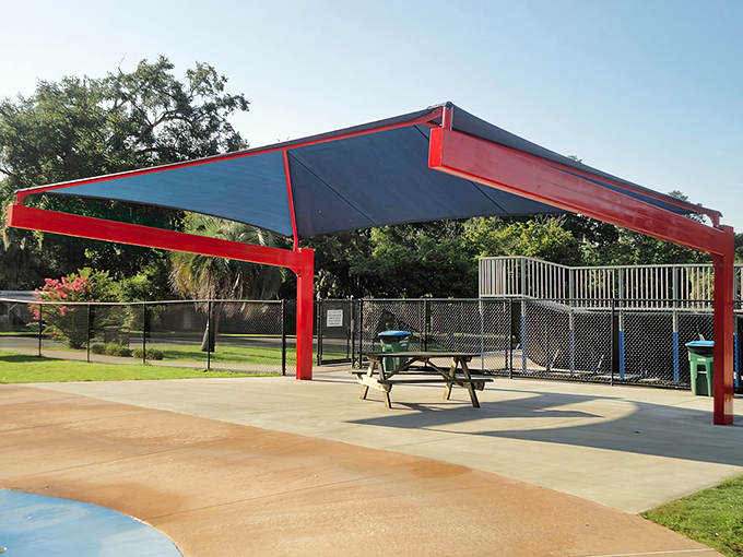 A shaded rest area with picnic tables offers sweet relief from Florida's relentless sunshine, perfect for recharging between splash sessions.