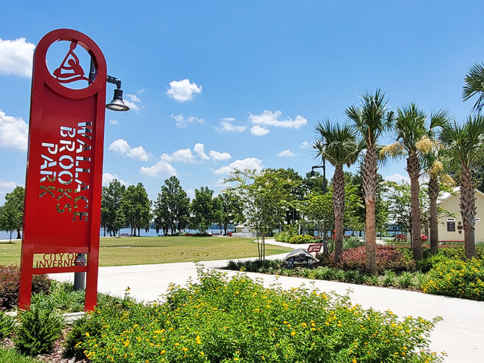 The bold red Tiki Park sign stands tall against palm trees, announcing "relaxation ahead" to all who enter.