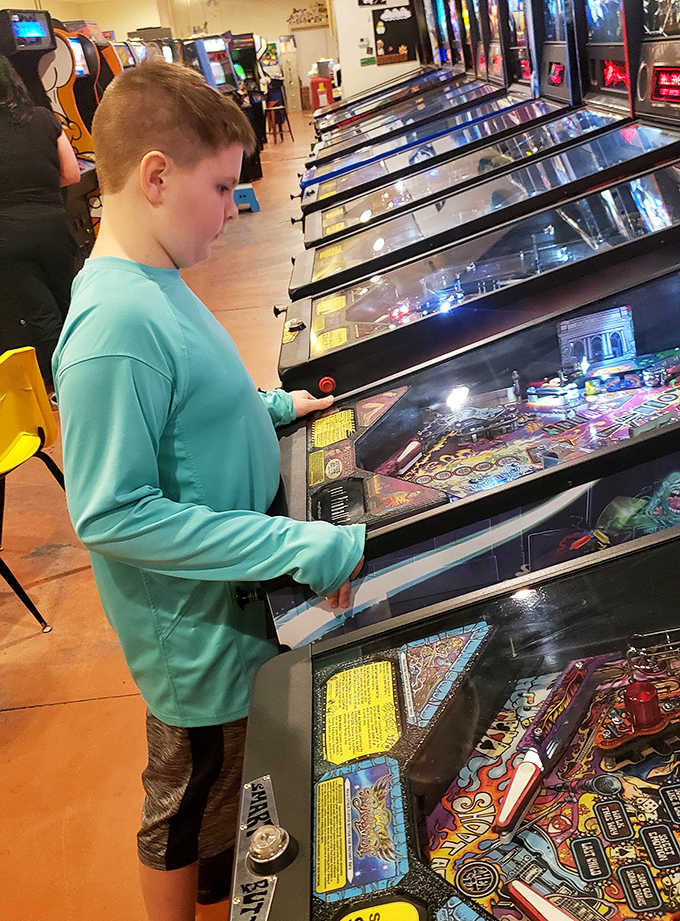 The magic of arcades lives on as a young gamer discovers the simple joy of physical controls and immediate feedback.