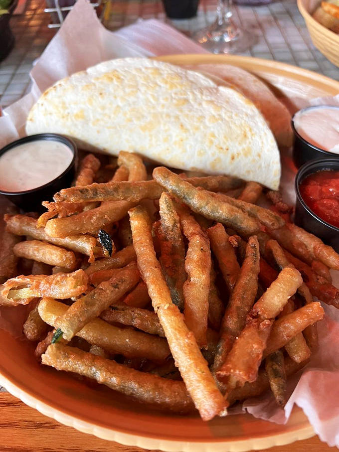These aren't just any shrimp tacos &ndash; they're vacation on a plate, with those zucchini fries stealing the spotlight from regular fries everywhere.