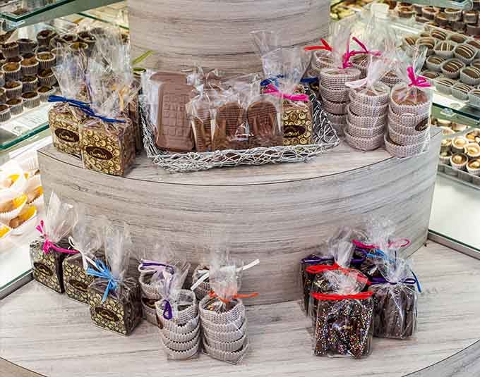 Rows of handcrafted chocolates at Miami Beach Chocolates gleam under the lights like edible jewels waiting to be discovered.