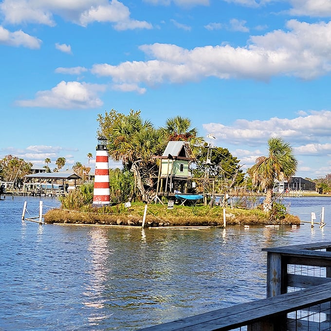 Monkey Island's tiny lighthouse and palm trees create a primate paradise in the middle of Homosassa River &ndash; no reservations required for these lucky residents!