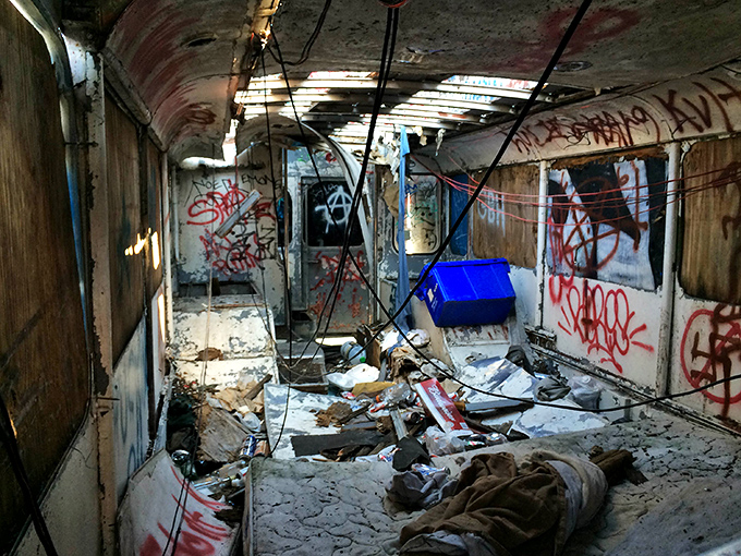 Urban artists have turned this abandoned bus into a stationary masterpiece, its white shell now wearing a technicolor coat of tags, murals, and street expressions.