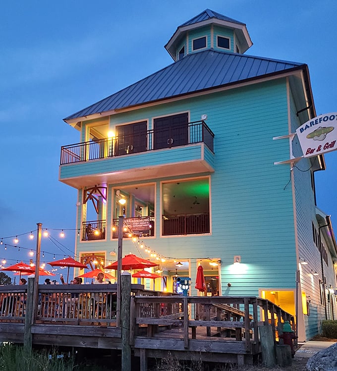 As twilight falls, Barefoot on the Bay transforms into a glowing beacon. The warm lights invite you to linger over one more round of fresh oysters.