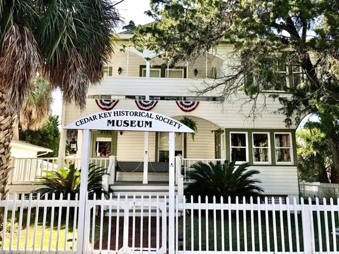 Cedar Key's Historical Society Museum preserves the fishing village's rich past in a charming white clapboard building trimmed with patriotic bunting.