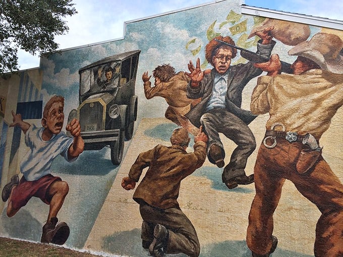 Drama leaps off the wall in this action-packed scene depicting the infamous 1931 bank robbery that became part of local folklore.