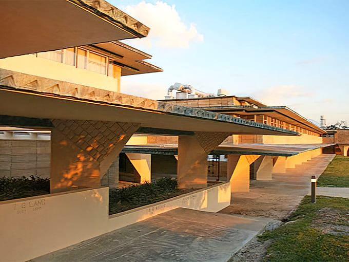 These covered walkways prove Wright understood Florida's sun situation, offering shade with serious architectural style and substance.